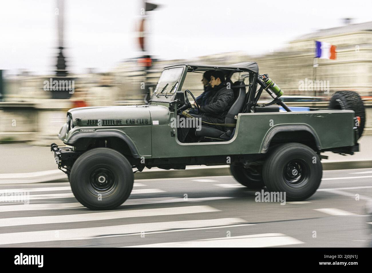 Old classic green off road car in the city, Jeep CJ8 Stock Photo - Alamy