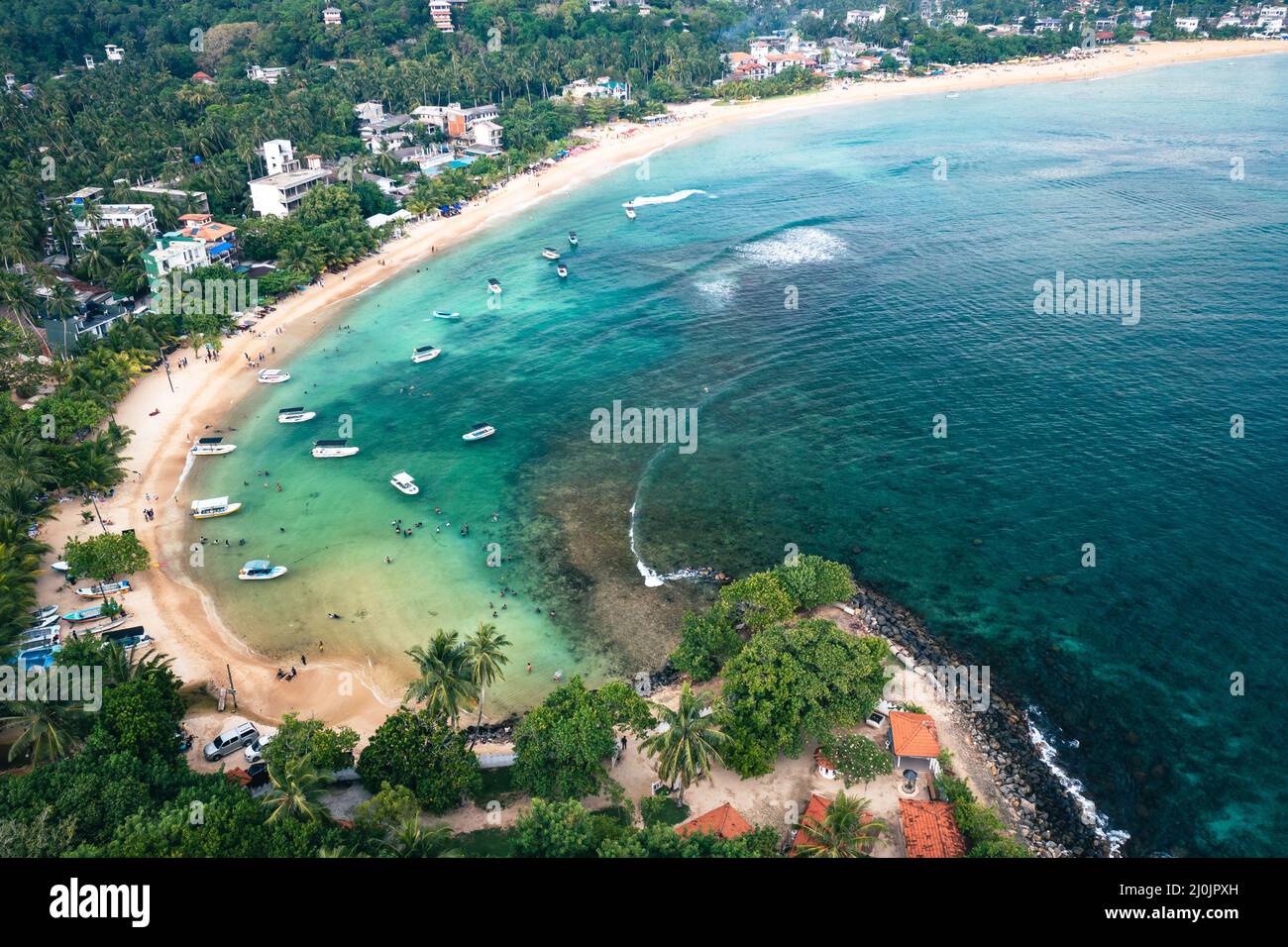 Aerial panorama of the tropical beach in the town of Mirissa, Sri Lanka ...