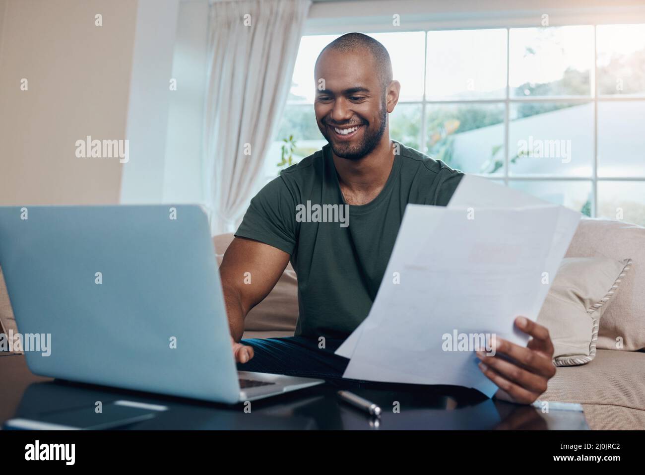 Cant be accused of not working hard. Shot of a young businessman ...