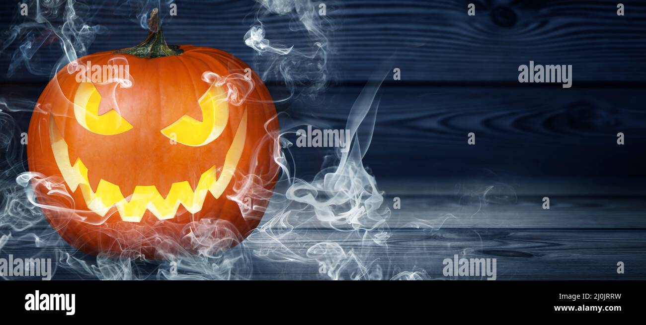 Halloween pumpkin face with burning fire inside Stock Photo - Alamy