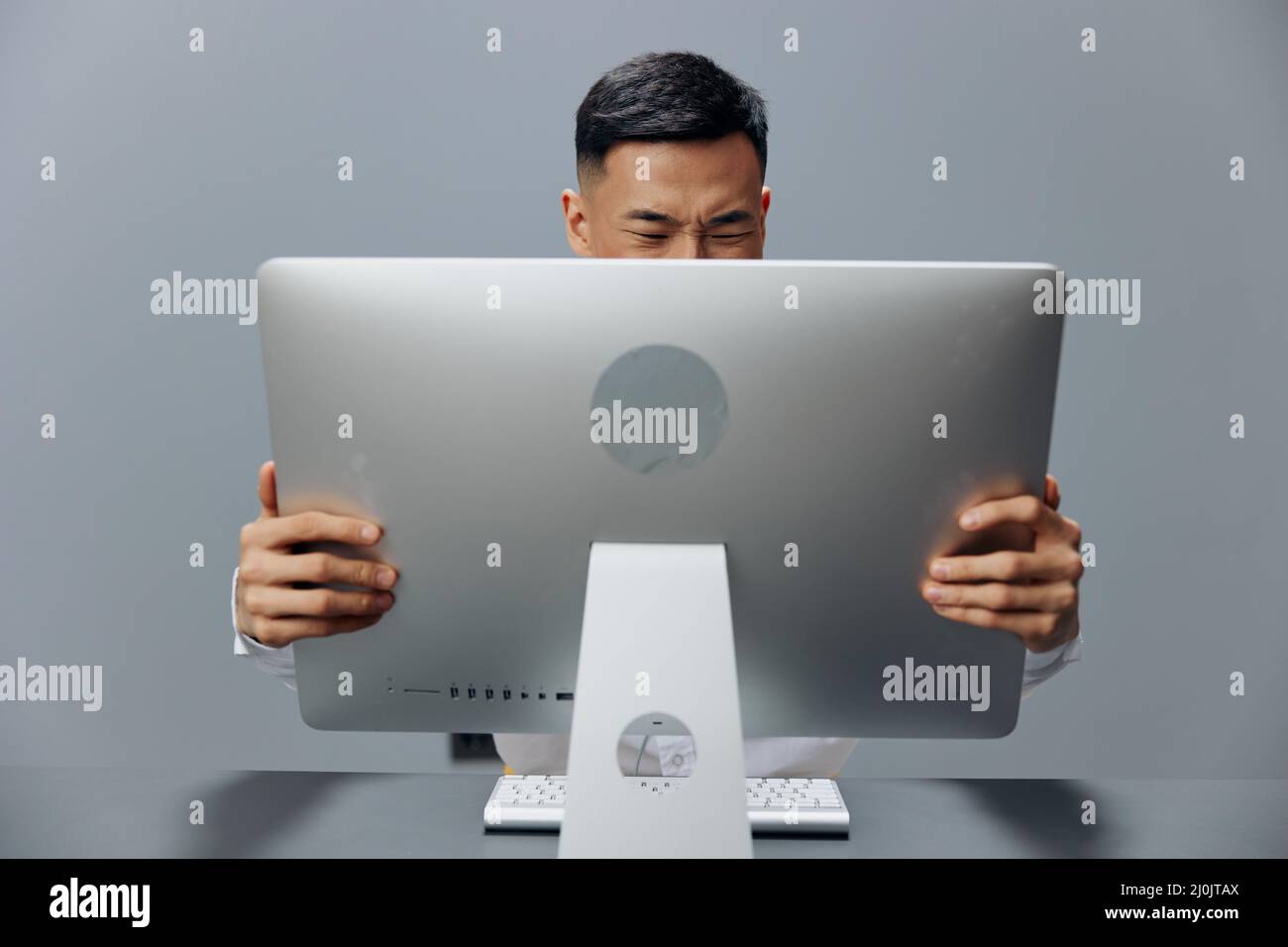 businessmen holding on to the monitor emotions office isolated ...