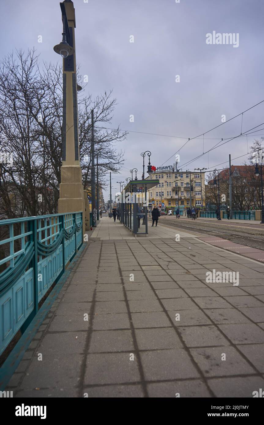 Sidewalk with a public transport tram stop Stock Photo - Alamy