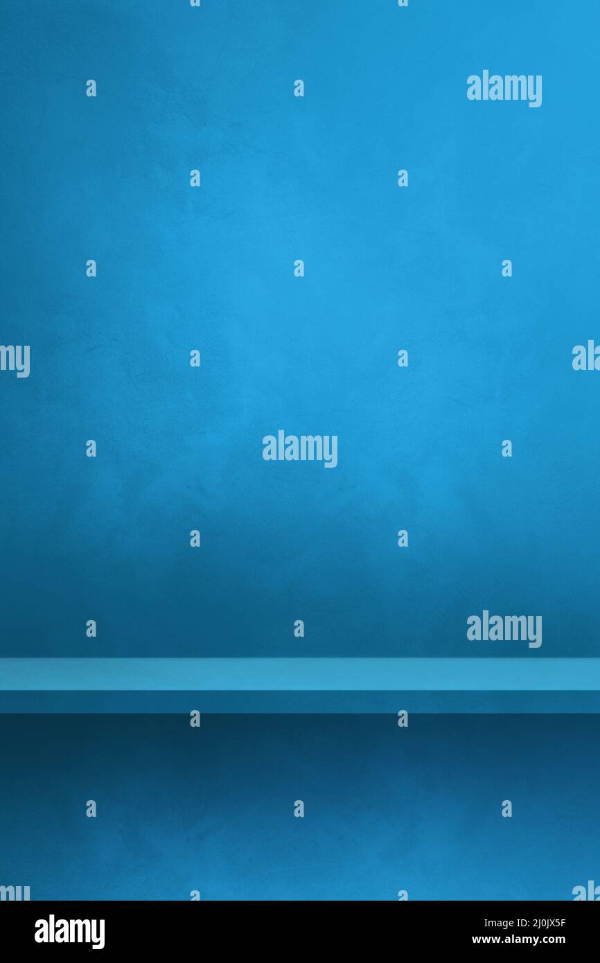 Empty shelf on a blue wall. Background template. Vertical backdrop ...