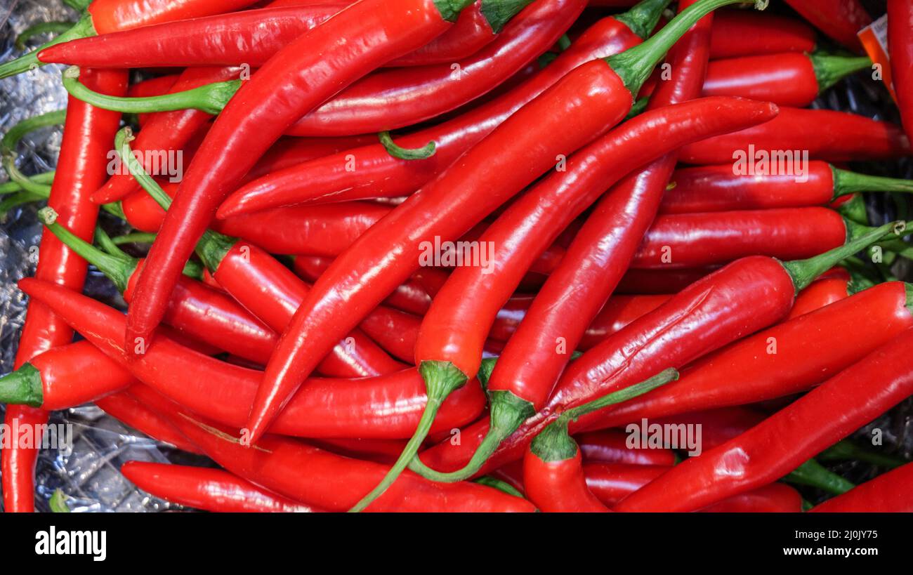 red chili pepper background top view Stock Photo - Alamy