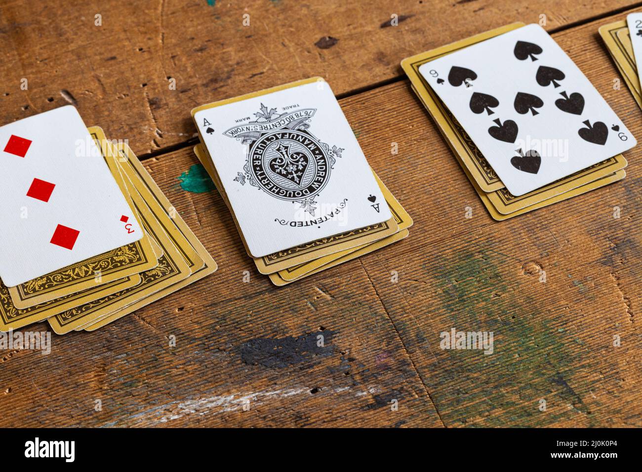 Playing cards on a rustic pioneer table at the Britannia Ship Yard in ...