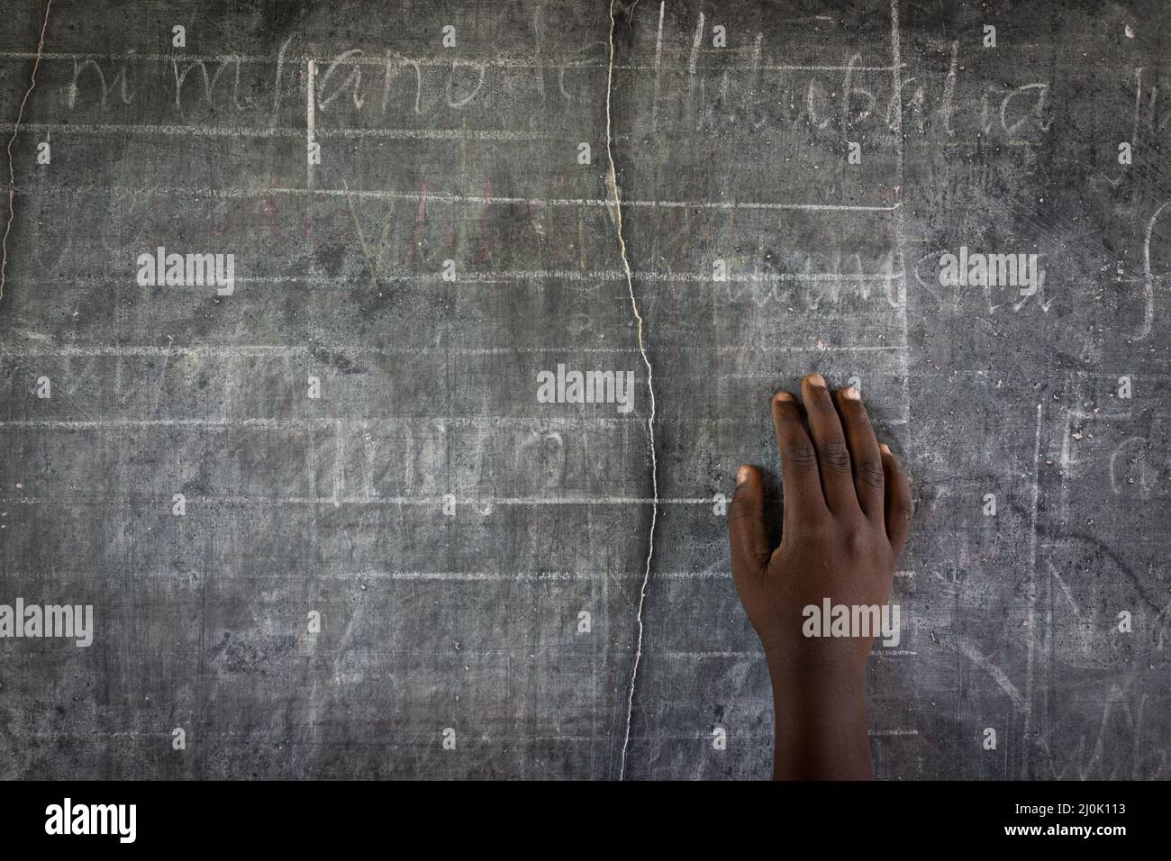 Authentic poor shool classroom with good boys studying Stock Photo - Alamy