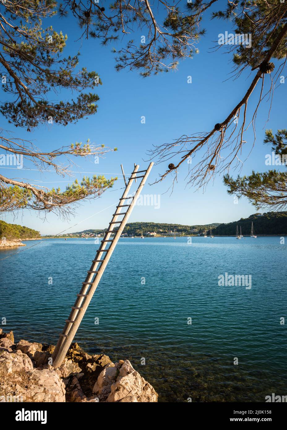 Beach ladder for fishing in croatia Stock Photo - Alamy