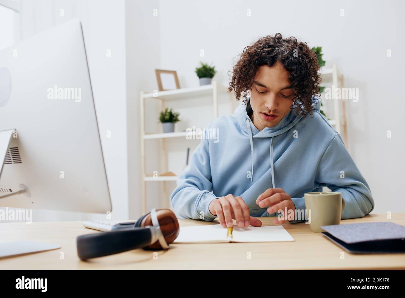 portrait of a man sitting in front of the computer internet online ...