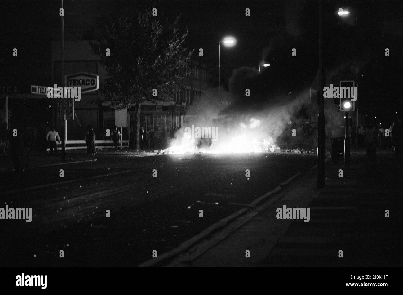 Southall Riots General scene pictures with people, policemen, fire, and ...
