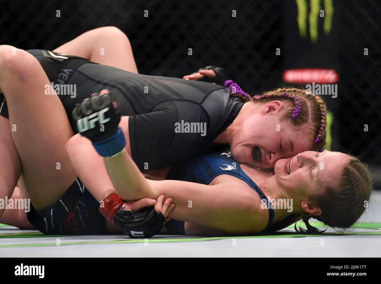 Cory McKenna seen in action with Elise Reed during the UFC Fight Night ...