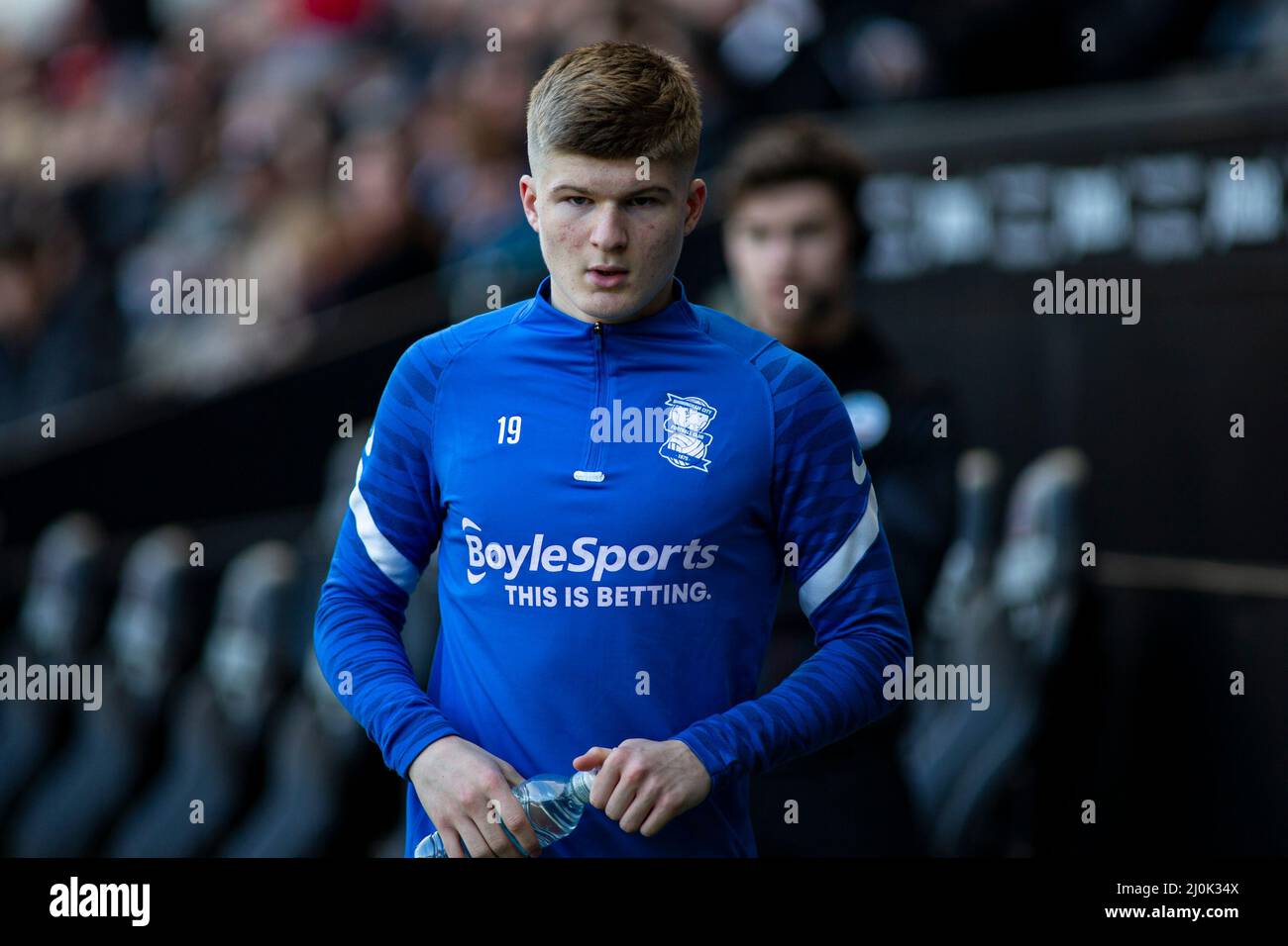 Swansea, UK. 19th Mar, 2022. Jordan James of Birmingham City ahead of ...