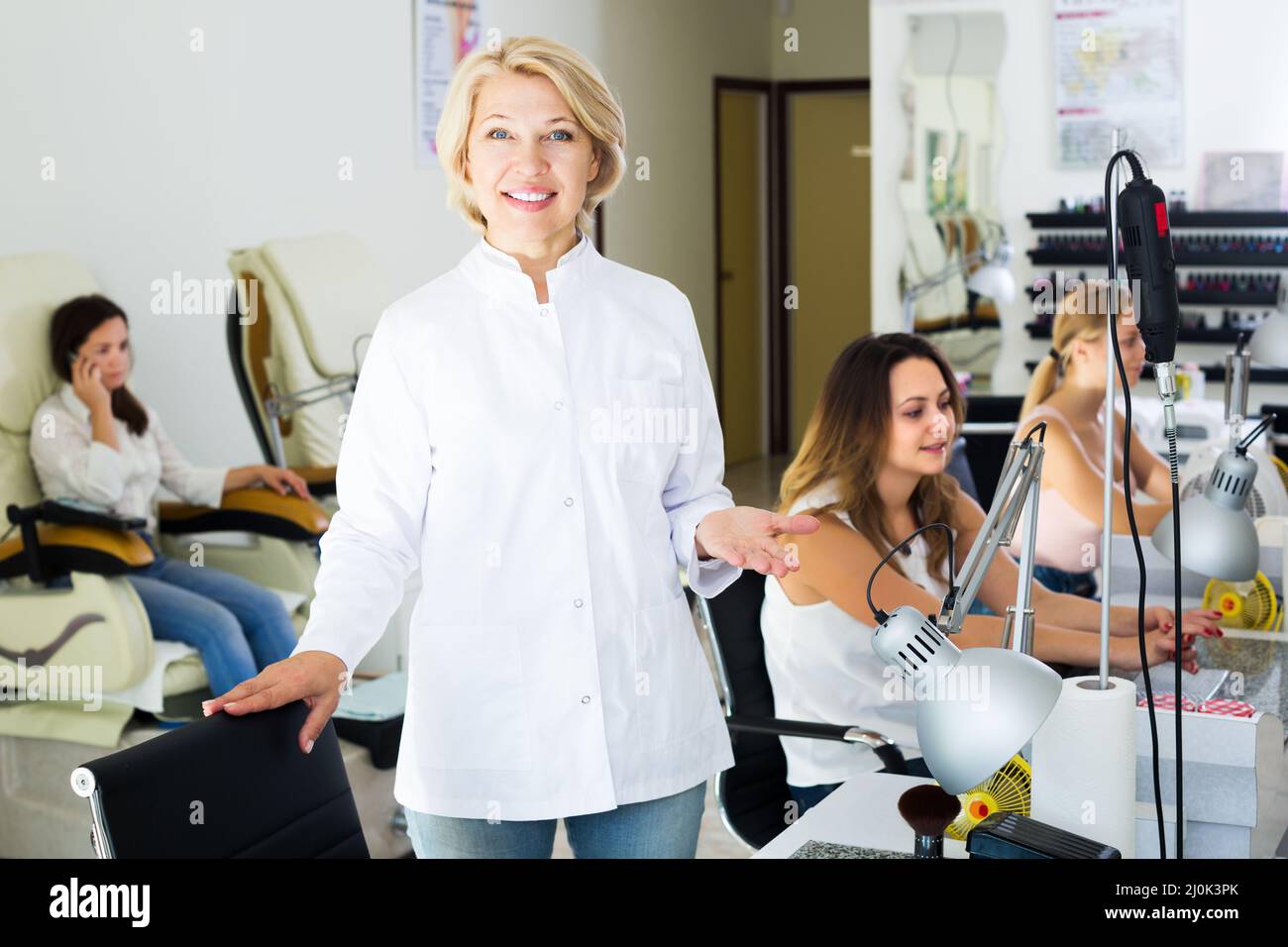 Woman doing nails displaying her workplace Stock Photo - Alamy