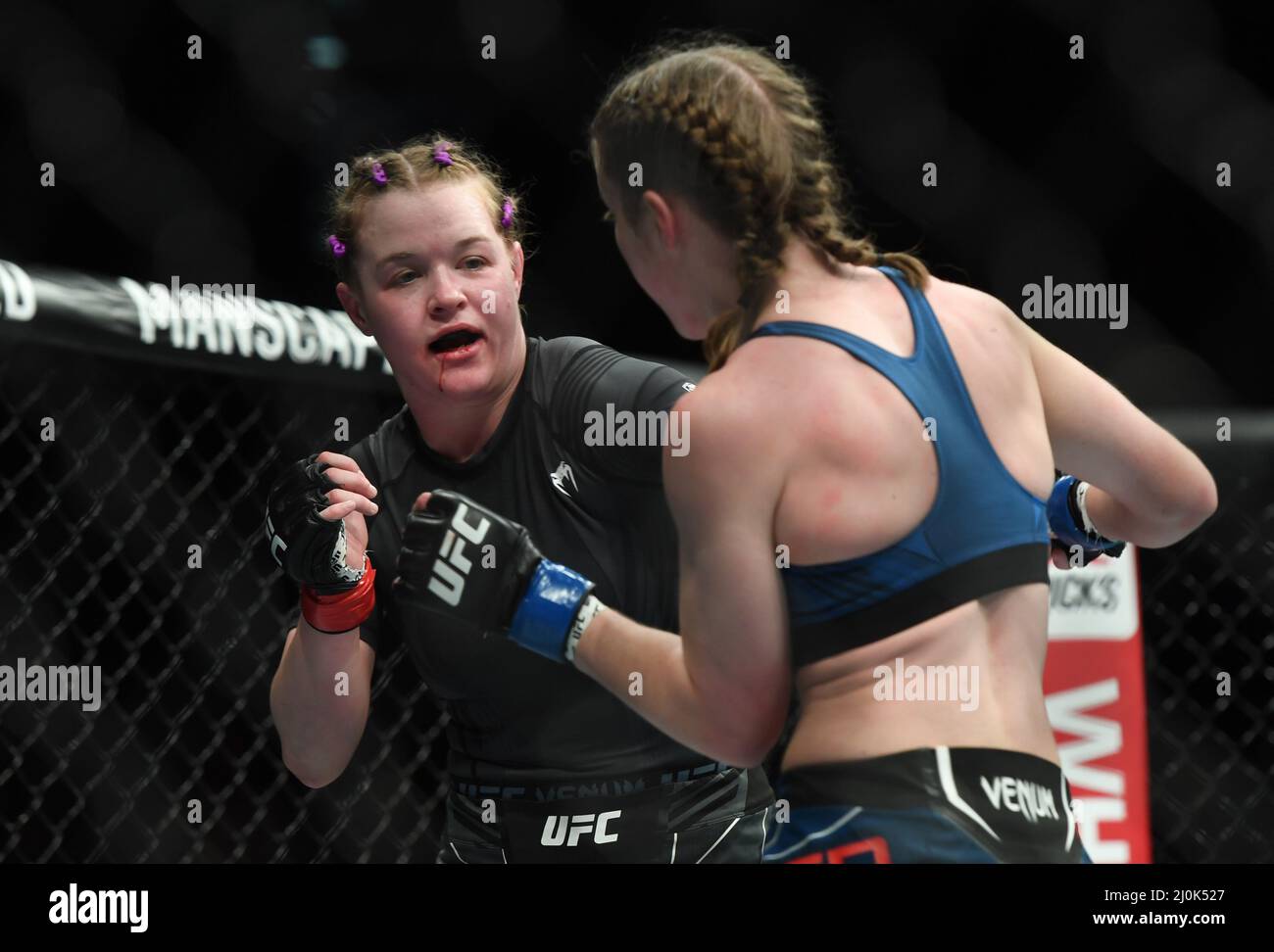 Cory McKenna seen in action with Elise Reed during the UFC Fight Night ...
