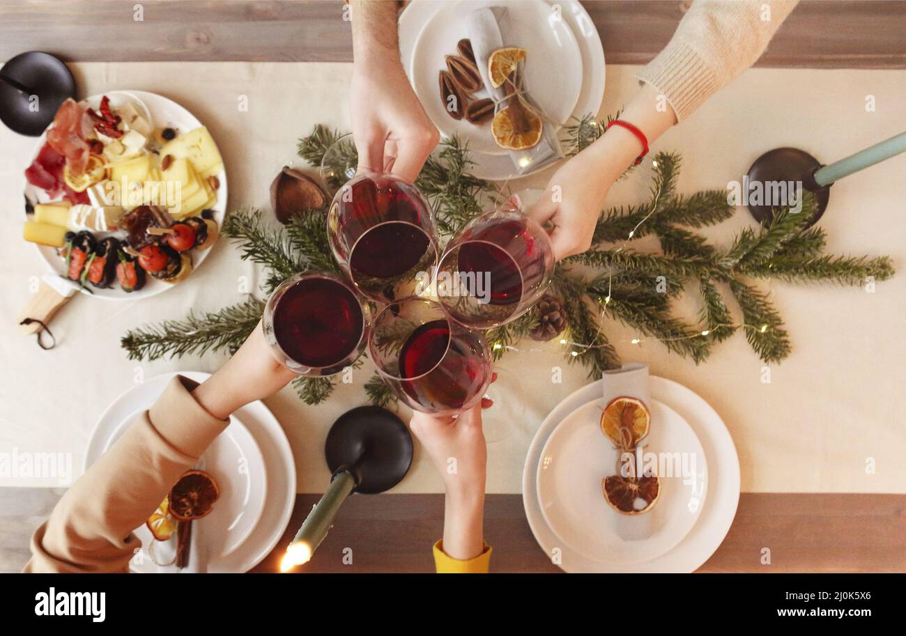 Crop people proposing toast over Christmas table Stock Photo - Alamy Crop people proposing toast over Christmas table Stock Photo - Alamy