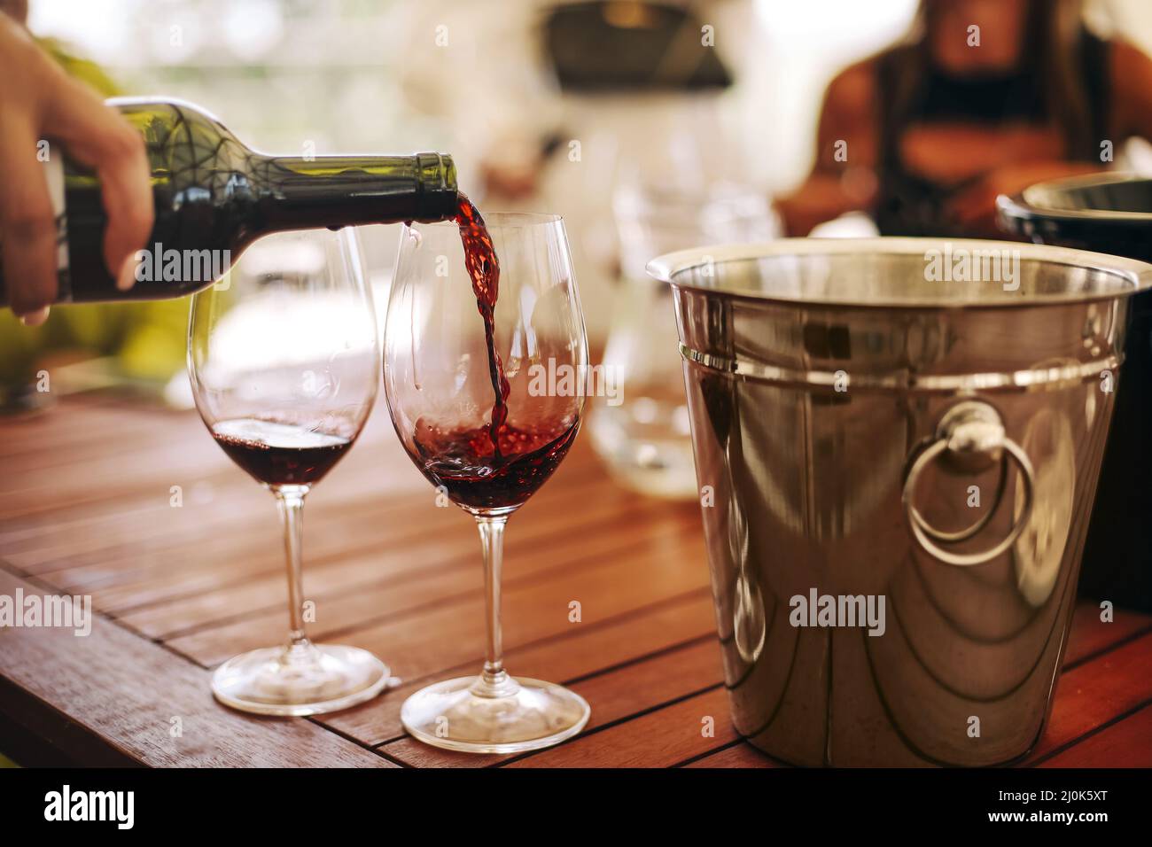 Glasses with different types of wine and human hands holding wine ...