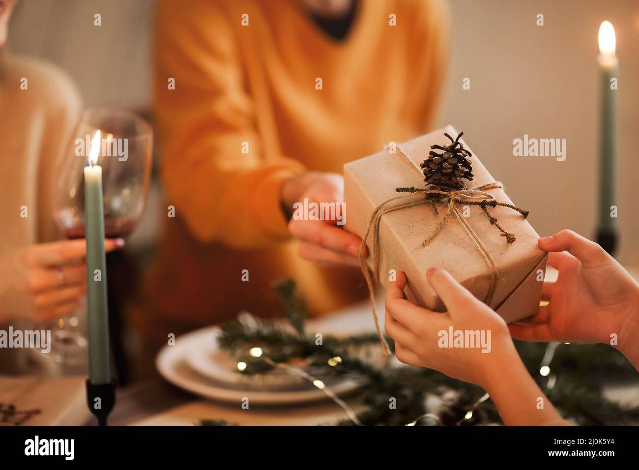 Crop people exchanging presents on Christmas day Stock Photo - Alamy