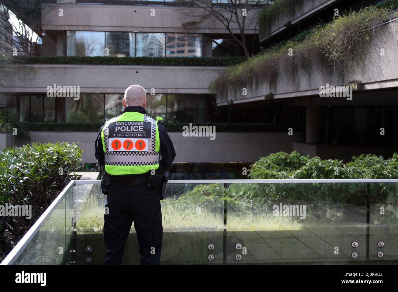 The police officer from the back standing in downtown Vancouver, Canada ...
