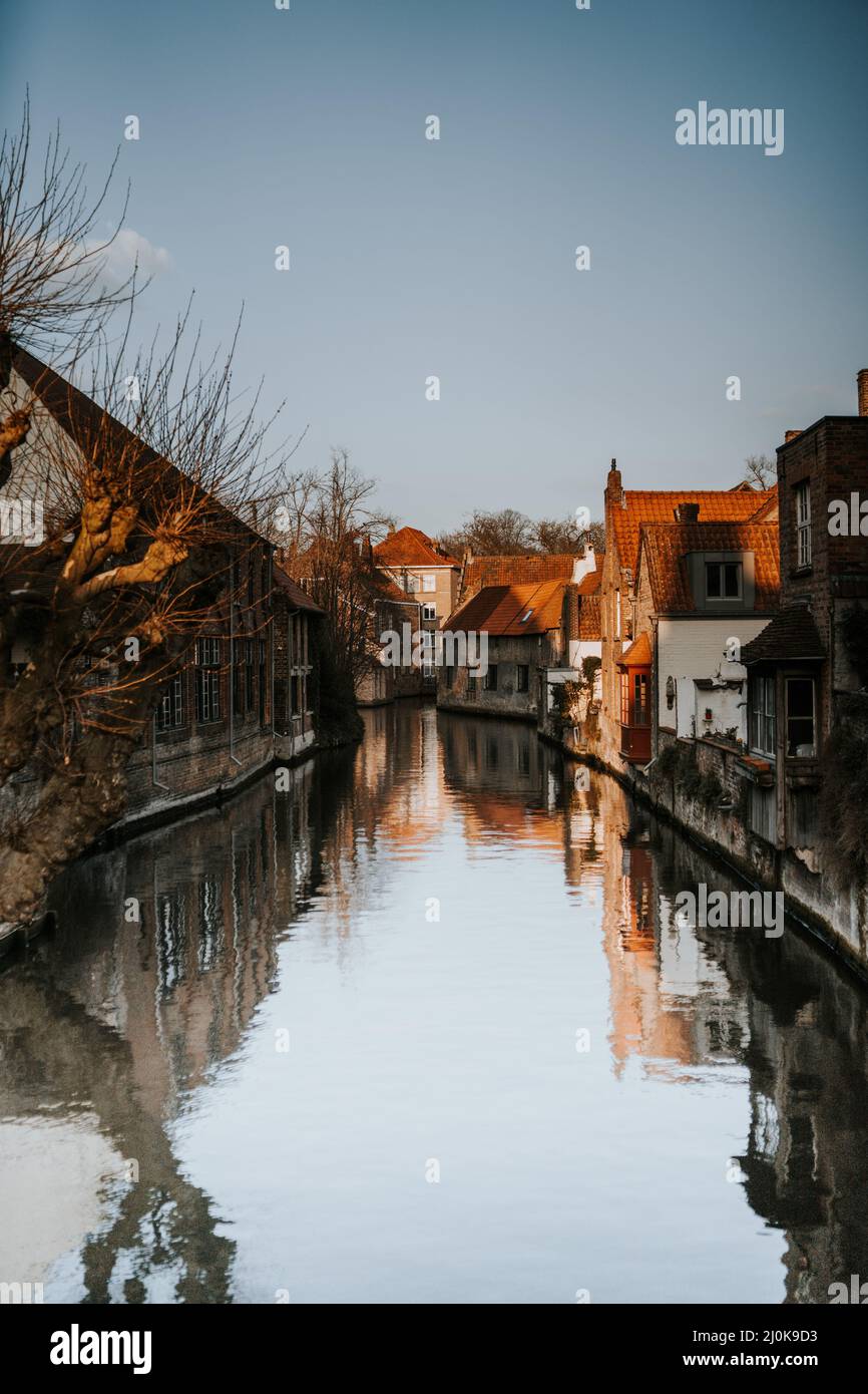 Vertical shot of traditional houses reflecting in a water canal Stock ...