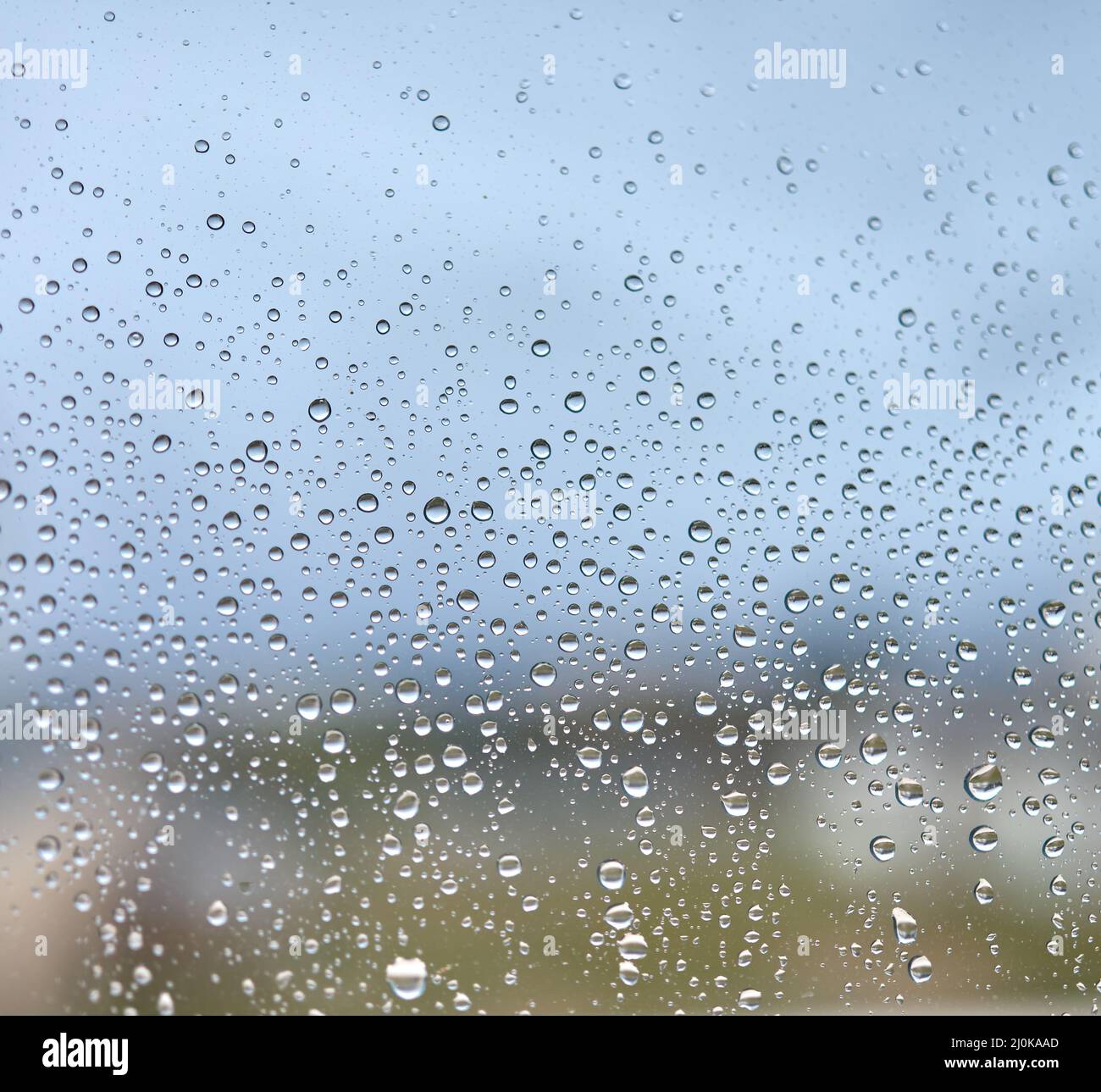 details of water droplets on a window on a gray day Stock Photo - Alamy