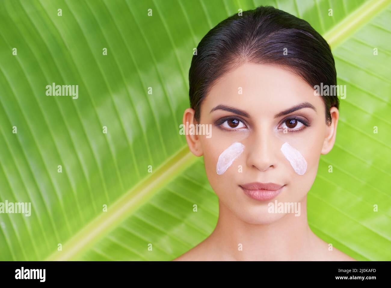 Taking a leaf out of natures beauty book. Studio portrait of a ...