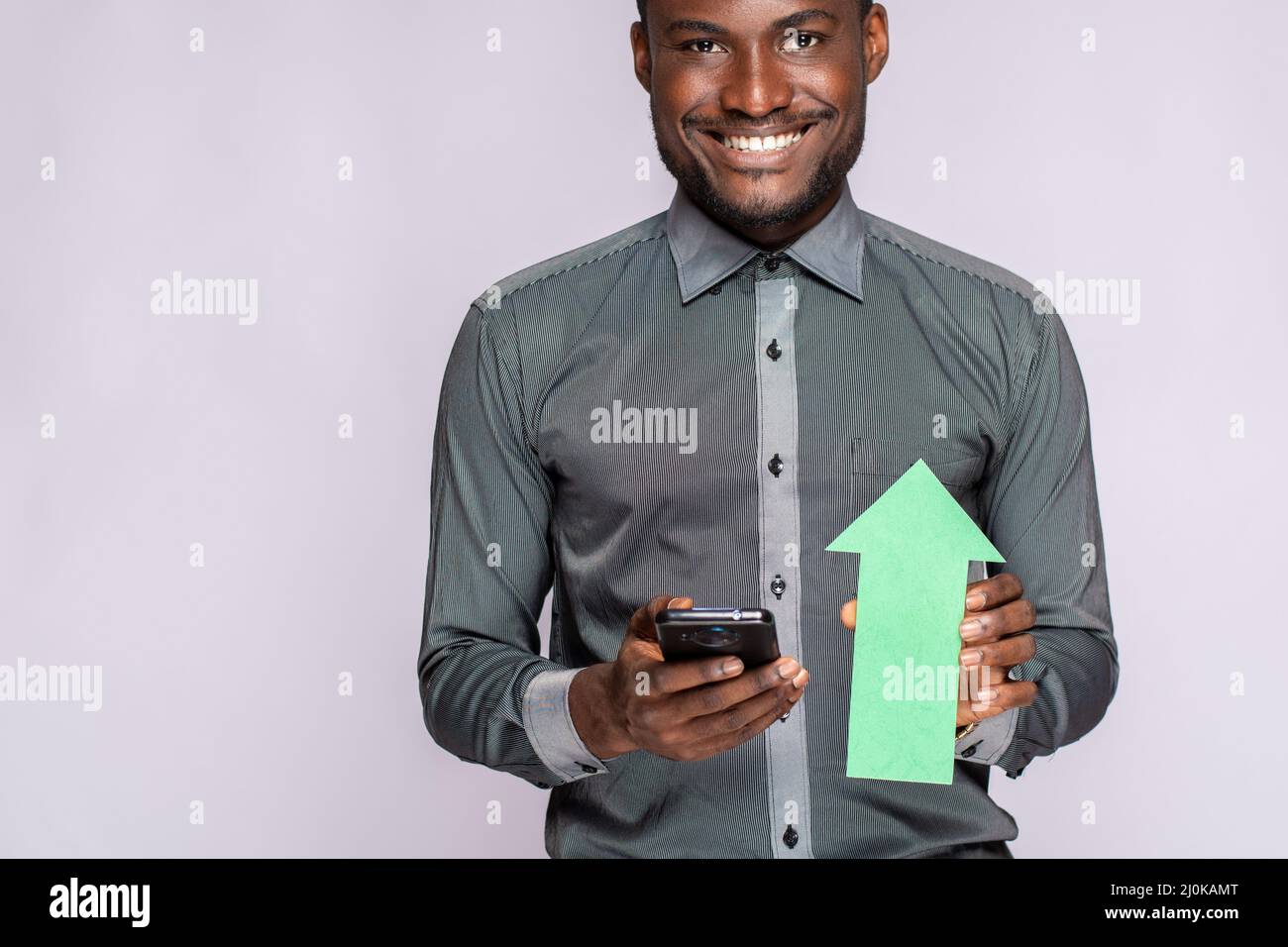 Man holding phone and arrow pointing upwards showing progress and ...