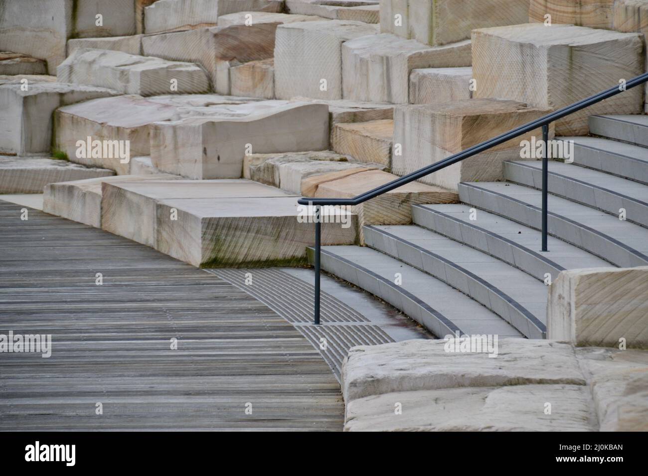 Sandstone blocks form natural coloured landscaping with steps and a ...