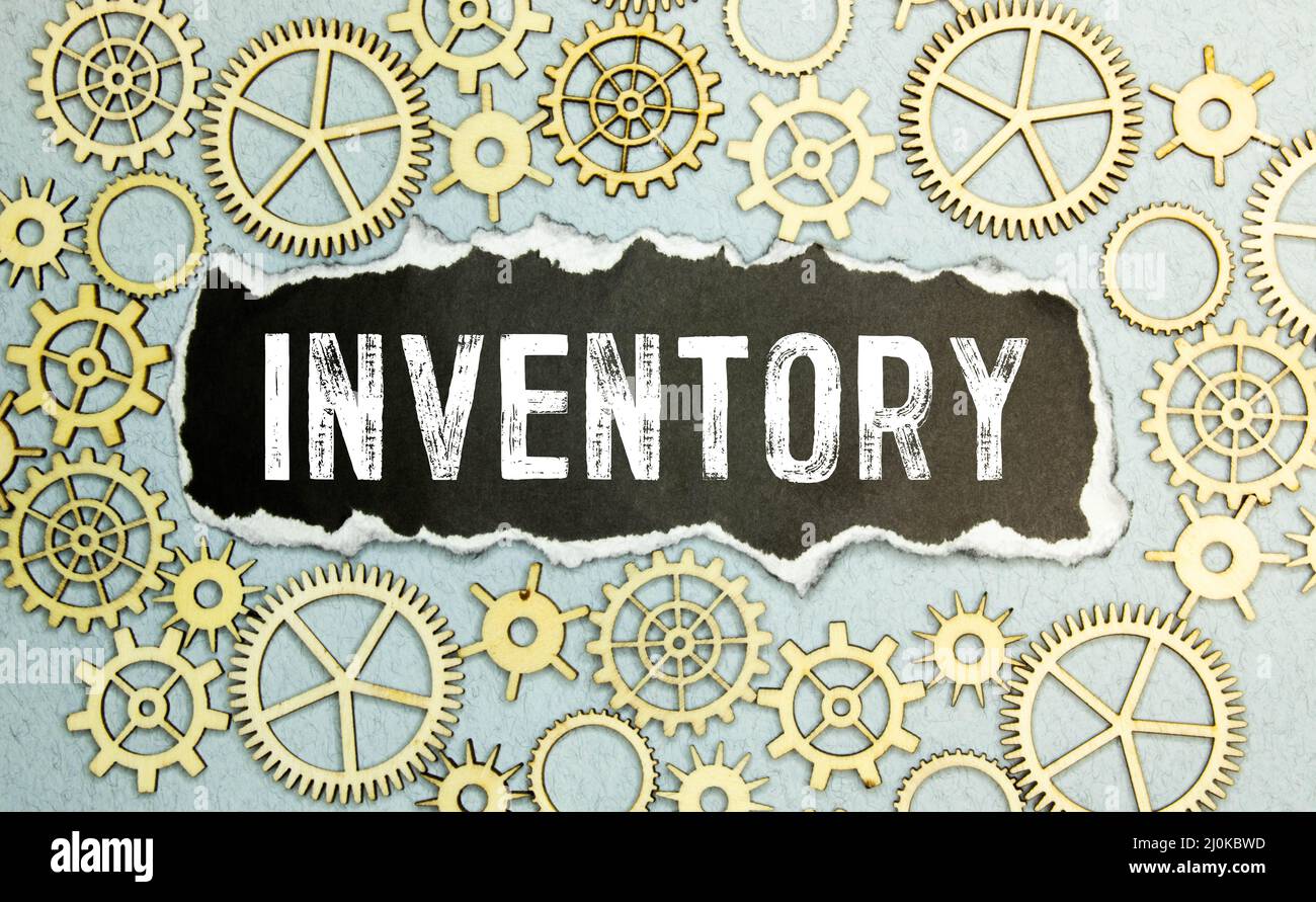 INVENTORY CONTROL text written on notebook with chart,calculator and ...