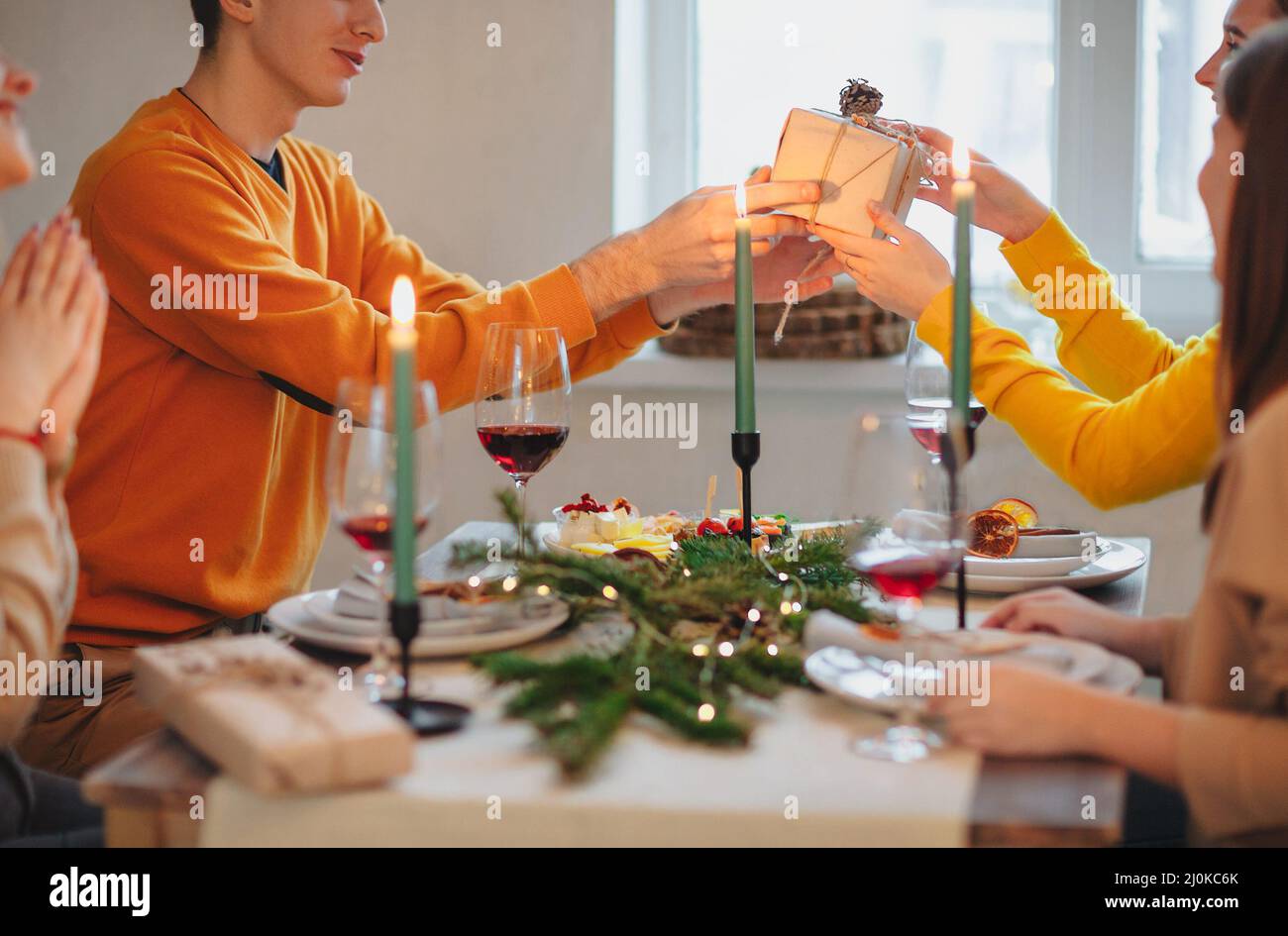 Crop people exchanging presents on Christmas day Stock Photo - Alamy