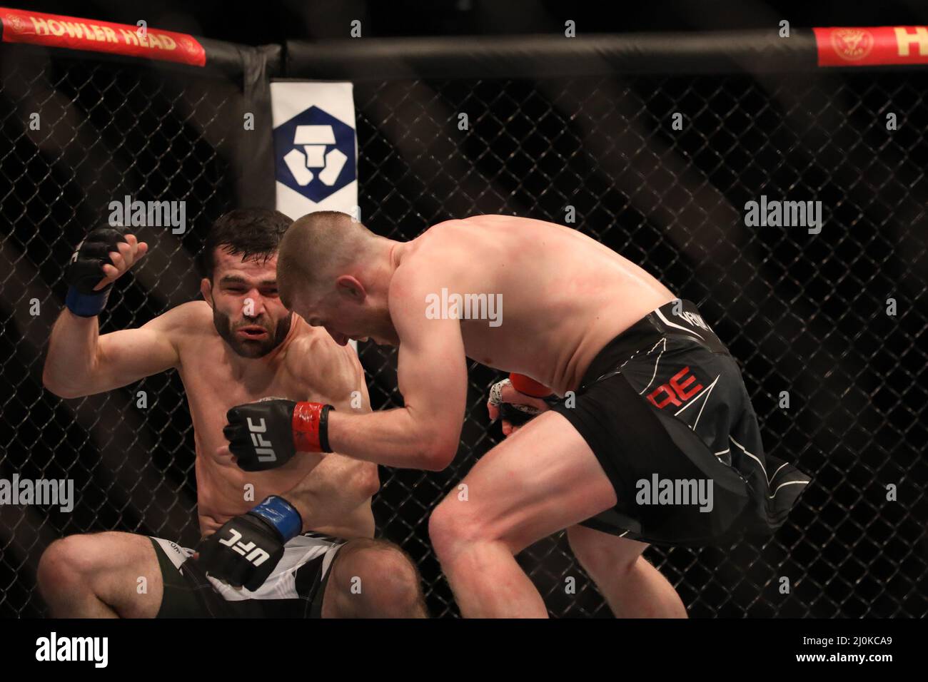 LONDON, UK - MARCH 19: (R-L) Jack Shore punches Timur Valiev in their ...
