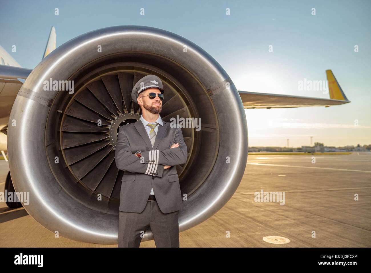 Aircraft pilot standing near turbine engine at airport Stock Photo - Alamy