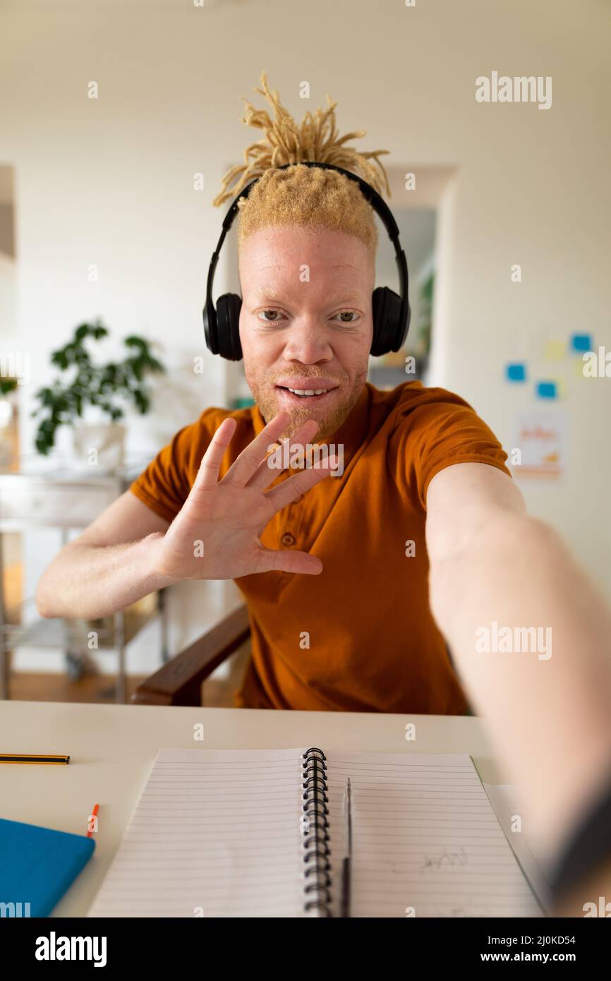 Albino african american businessman using hi-res stock photography and ...