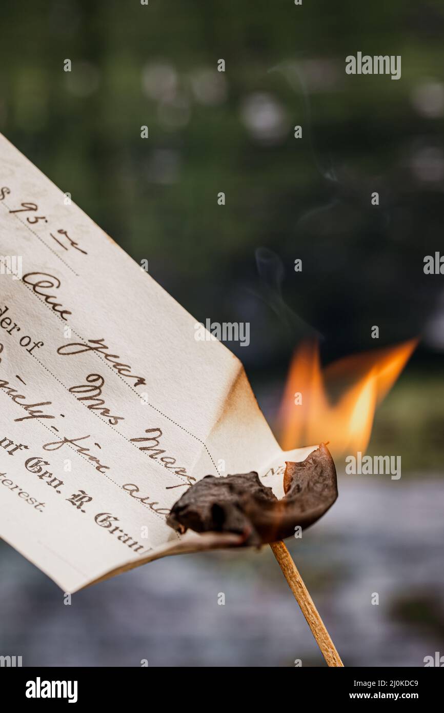 Flames rise from burning paperwork Stock Photo - Alamy