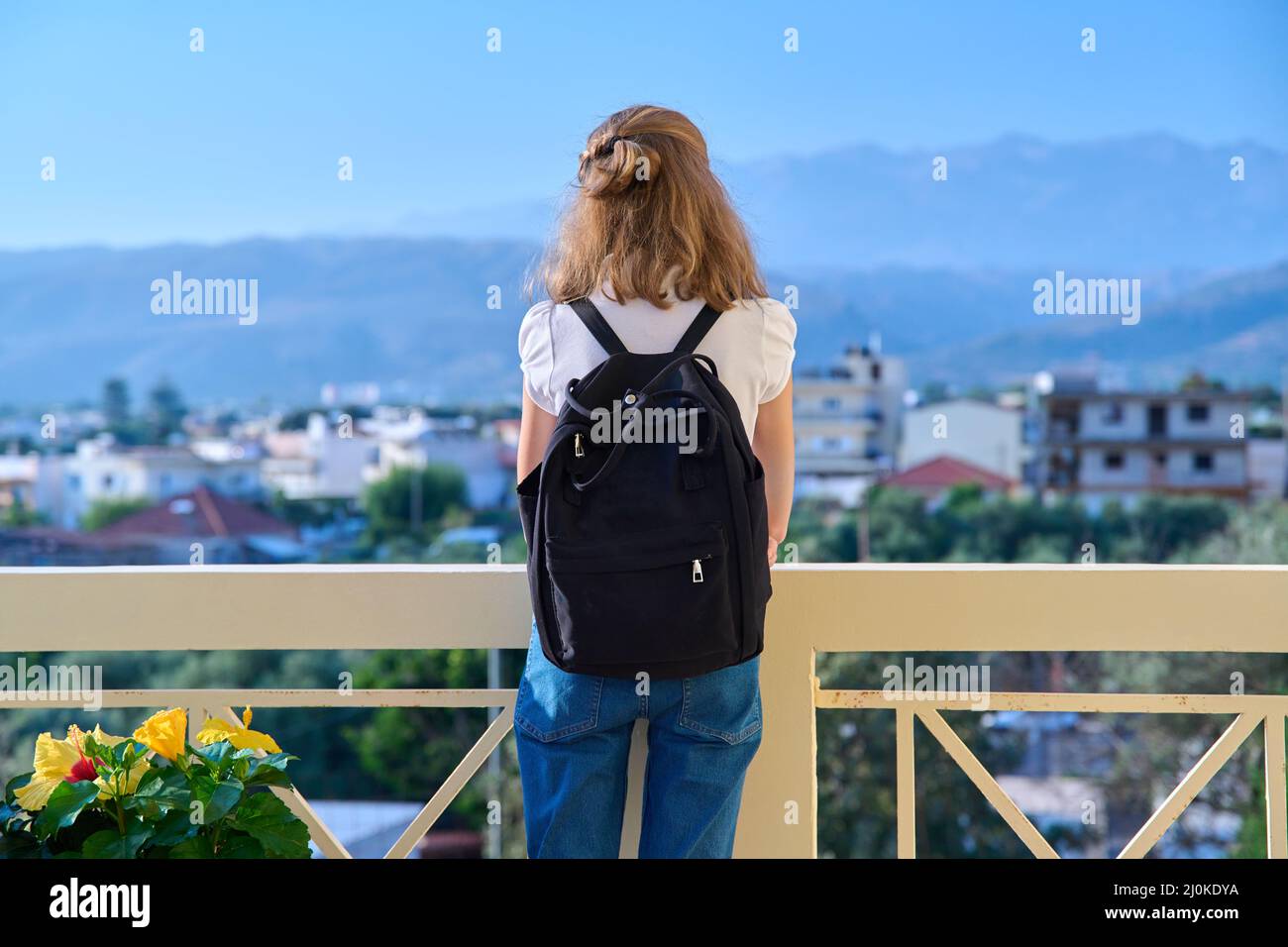 Back view, girl child with backpack outdoor Stock Photo - Alamy