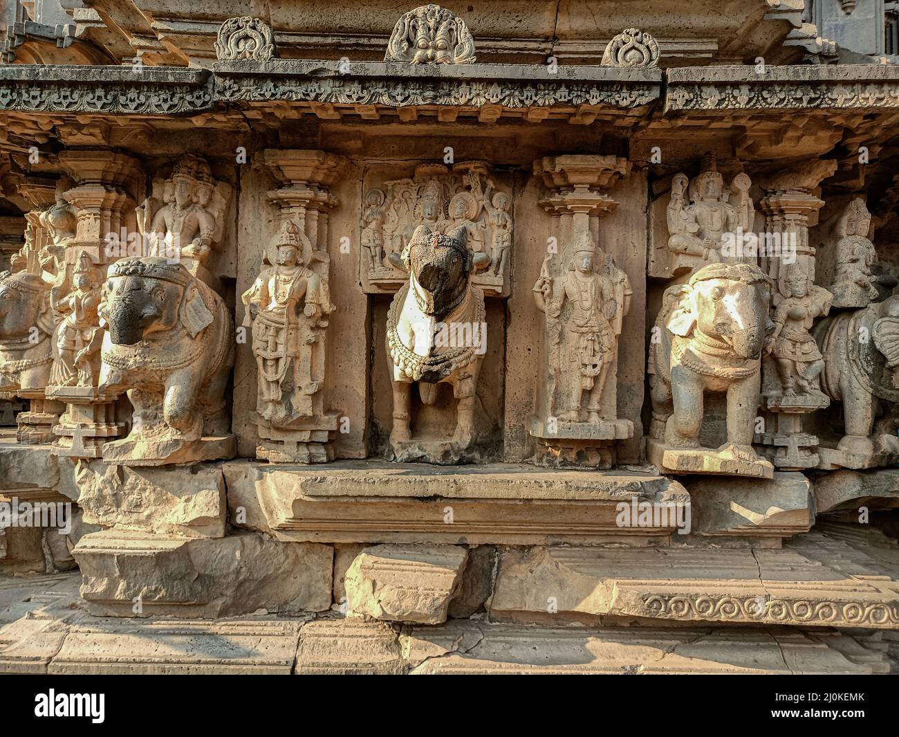 Ancient sculpture of a Hindu trinity god sitting on an elephant in ...