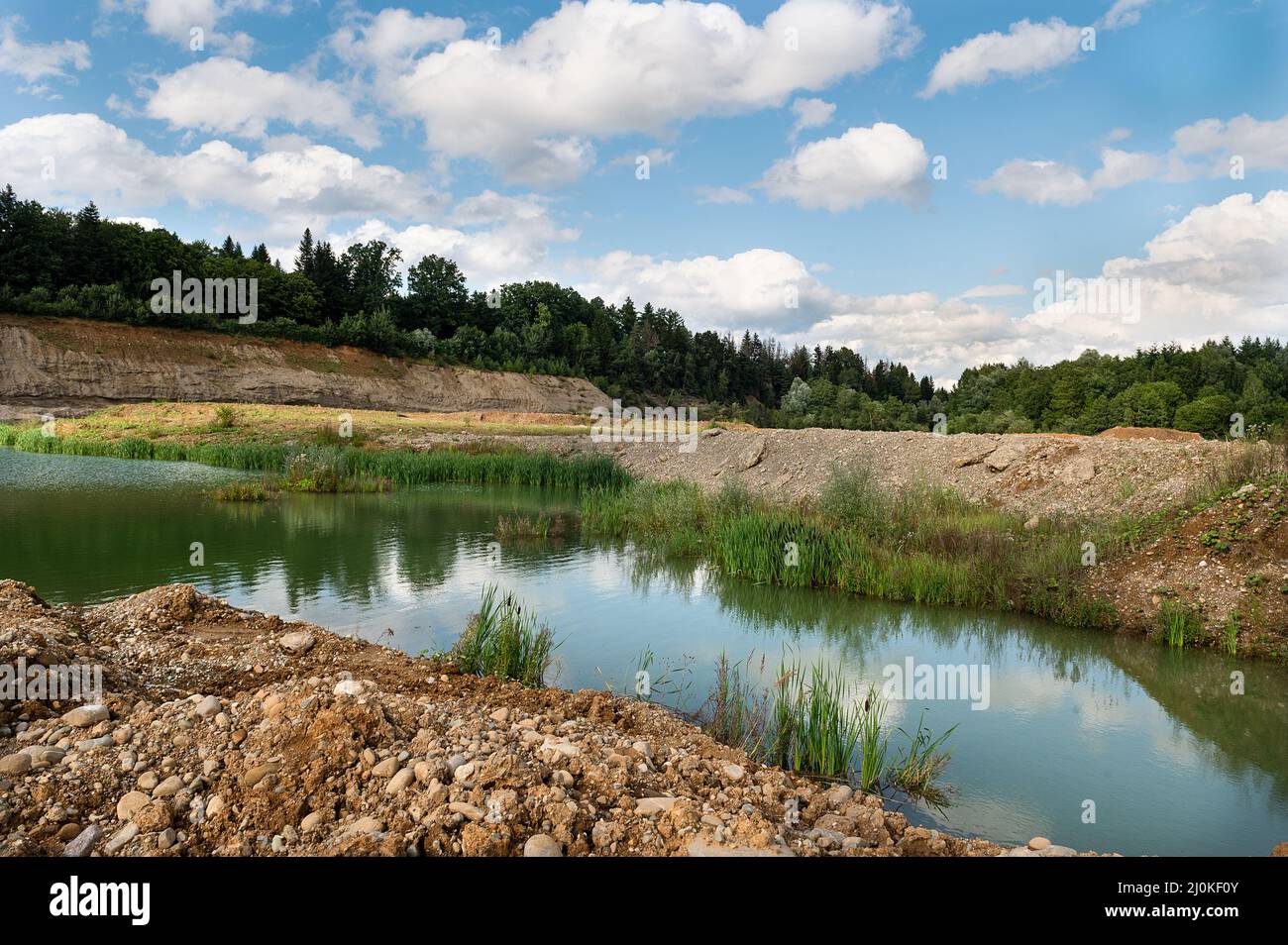 Quarry pond in germany Stock Photo - Alamy