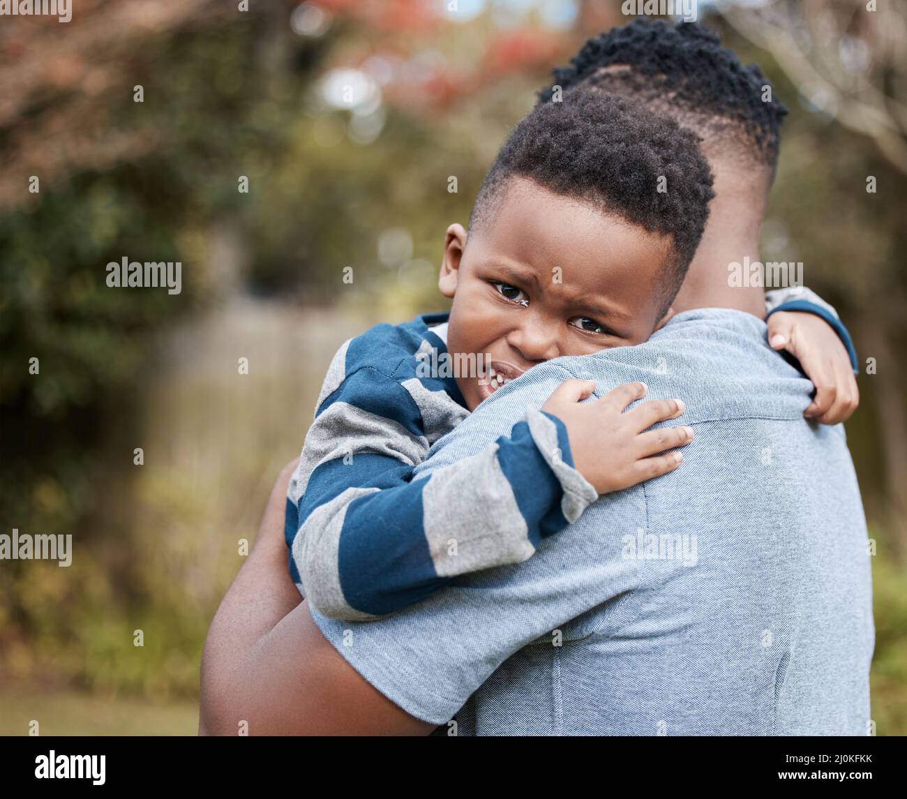 Father comforting crying child hi-res stock photography and images - Alamy