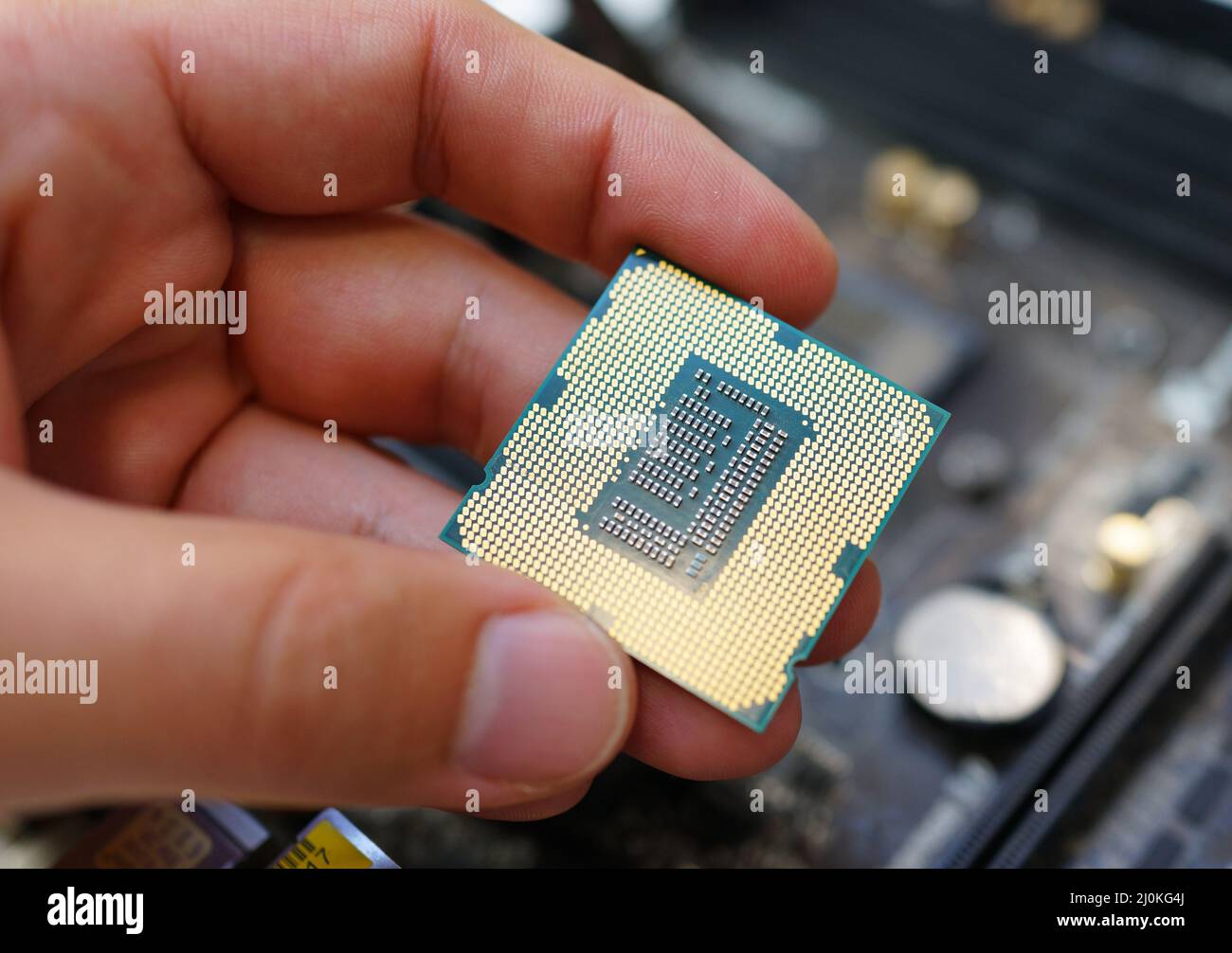 Working on motherboard and pc processor and memory Stock Photo - Alamy