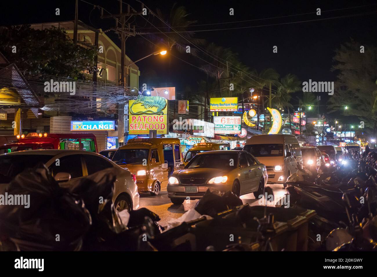 Thawewong Road in Patong by night. This road along Patong beach is very ...
