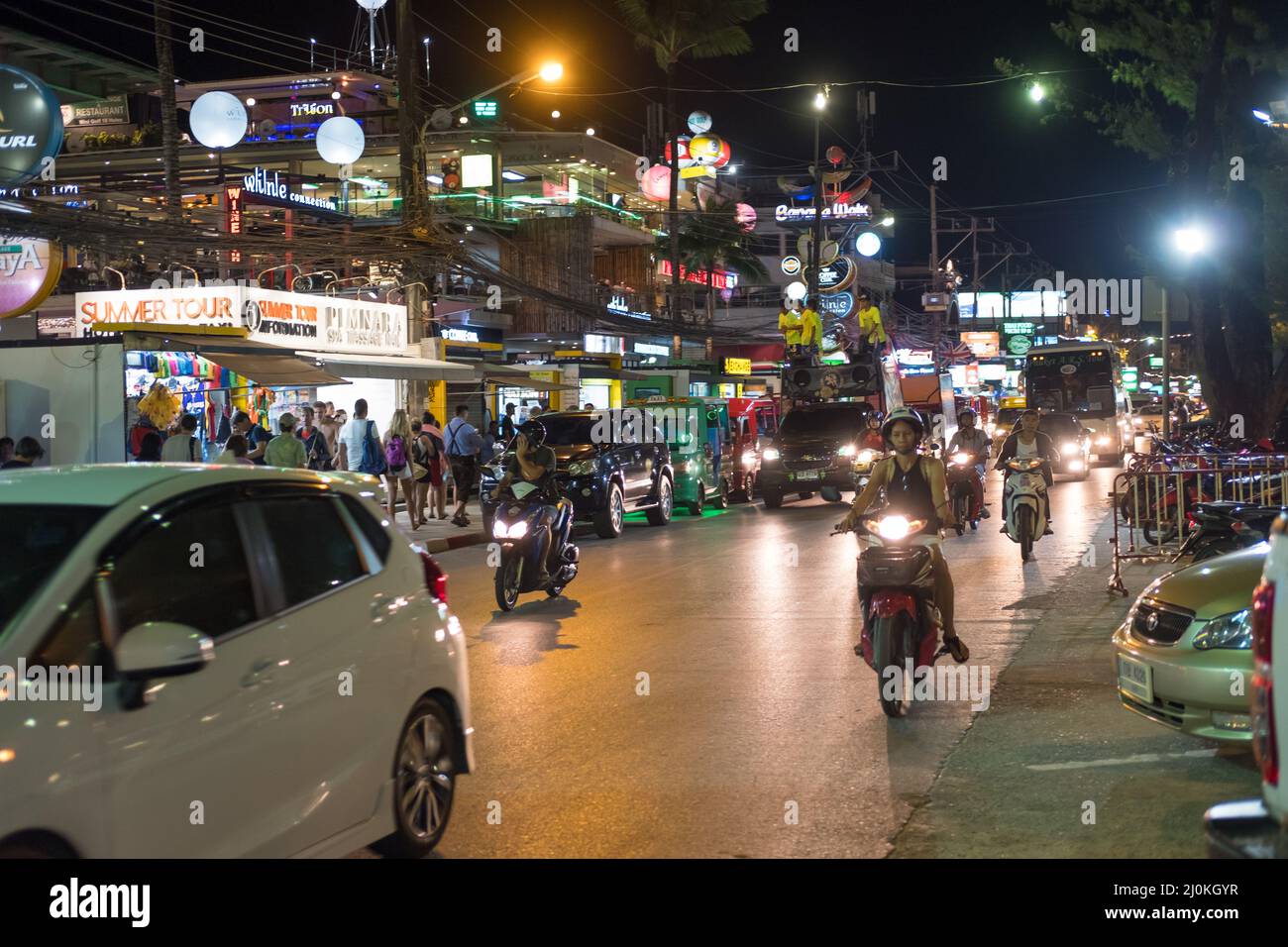 Thawewong Road in Patong by night. This road along Patong beach is very ...