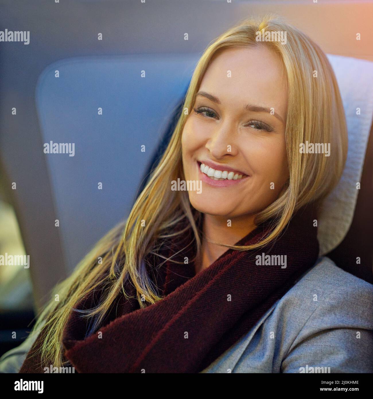 I love flying in style. Portrait of a young woman sitting in first ...