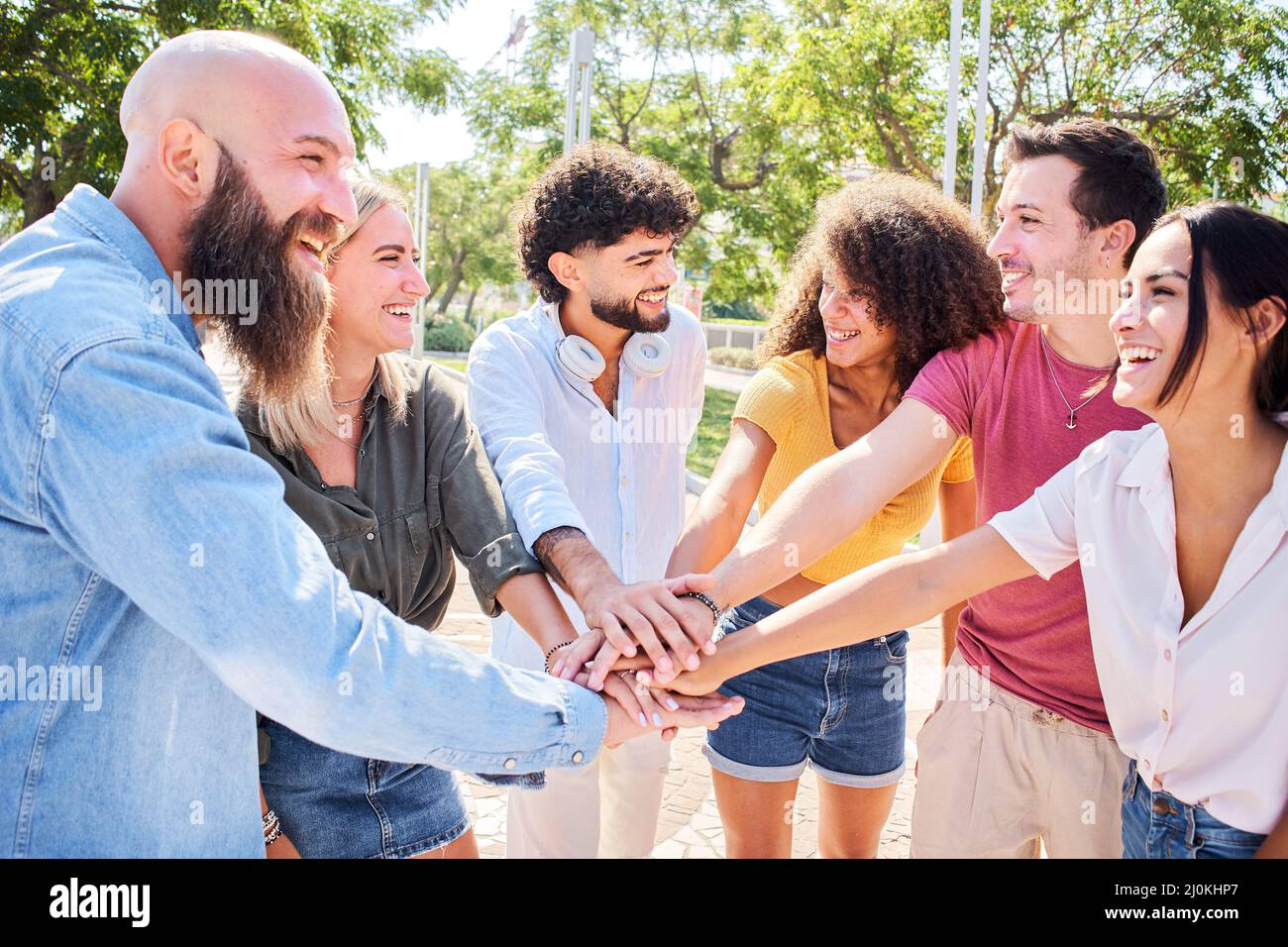 Group of people having fun together. Multiracial smiling friends ...