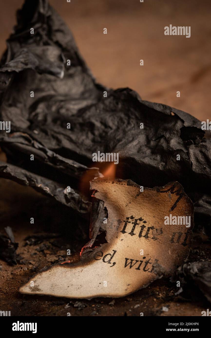 Burned book cover hi-res stock photography and images - Alamy