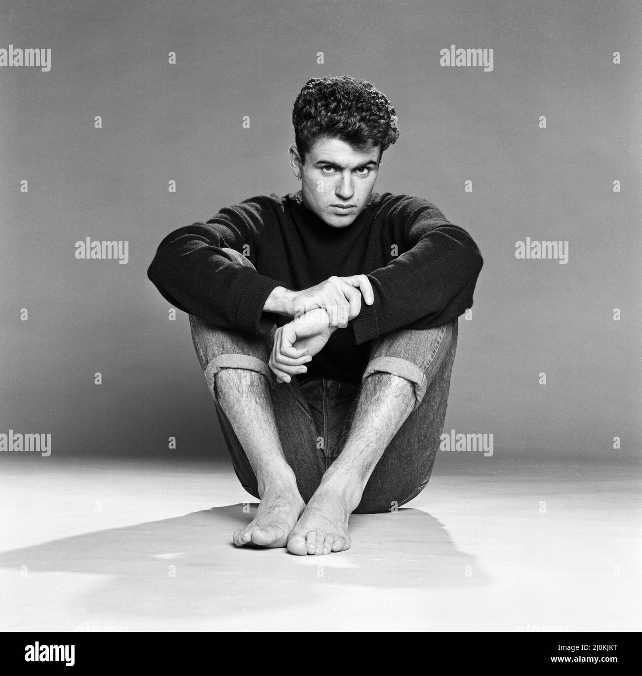 George Michael of the teenage pop duo Wham!, poses in the studio. 26th ...
