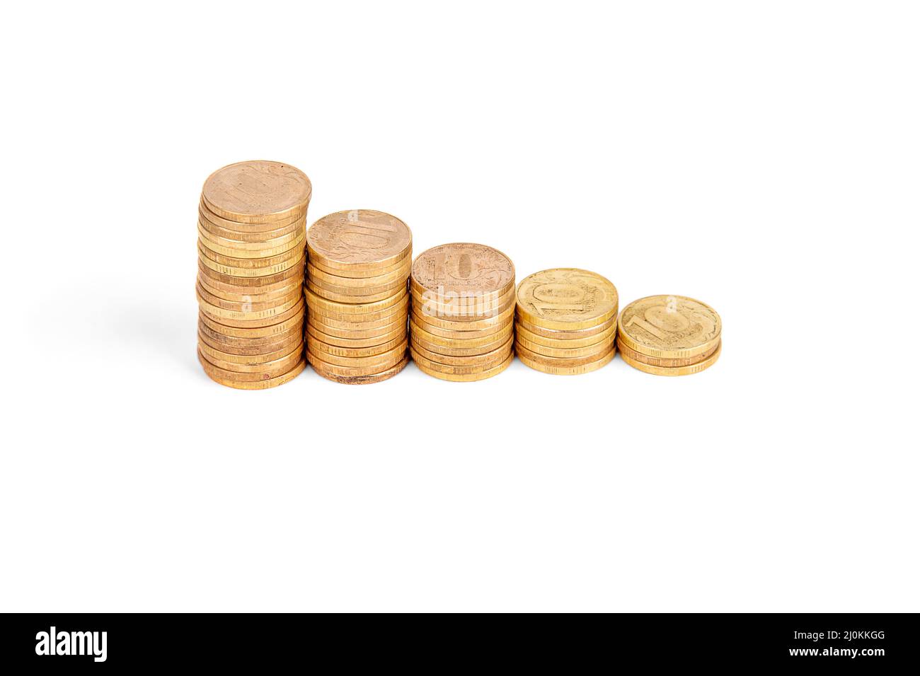 Stacks of coins of different heights isolated on a white background ...