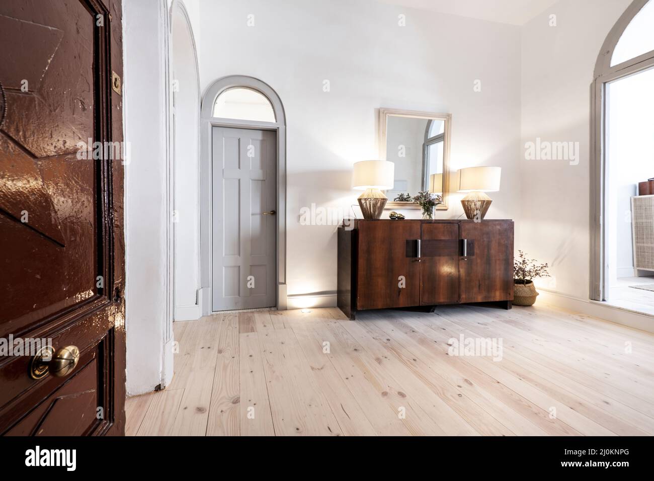 Distributor corridor of a house with eclectic decoration with white ...