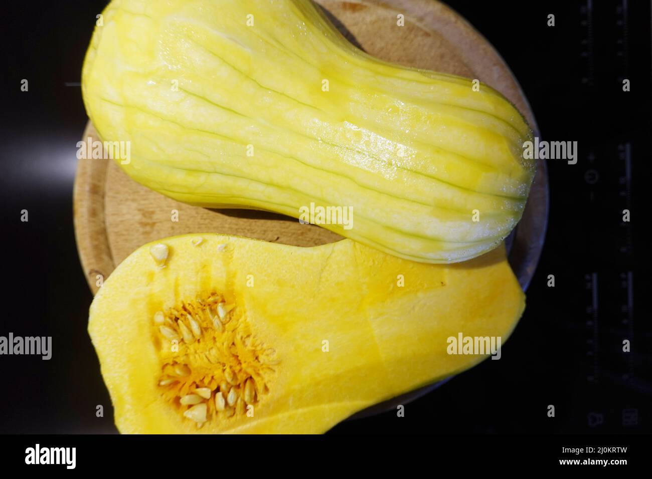 Peeled butternut squash, split down the middle Stock Photo - Alamy