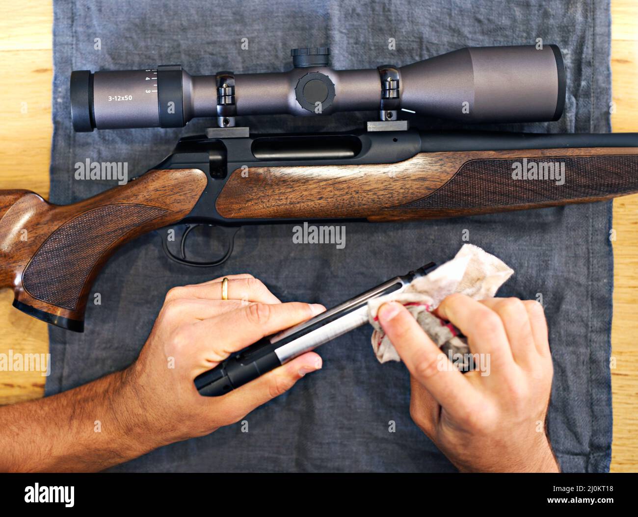 Regular maintenance is essential for every gun owner. Cropped view of a ...