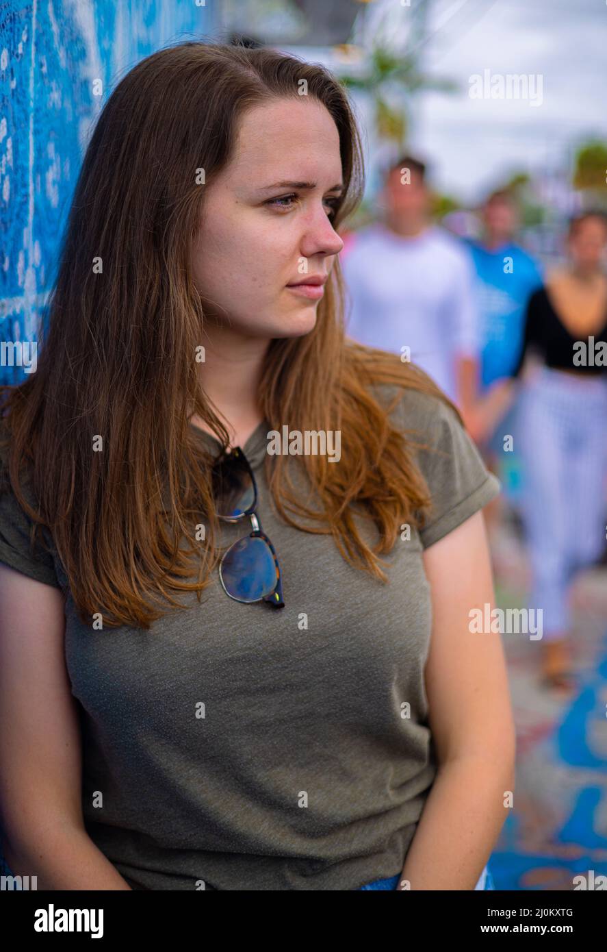 Street style photo shoot with a young pretty woman in the colorful ...