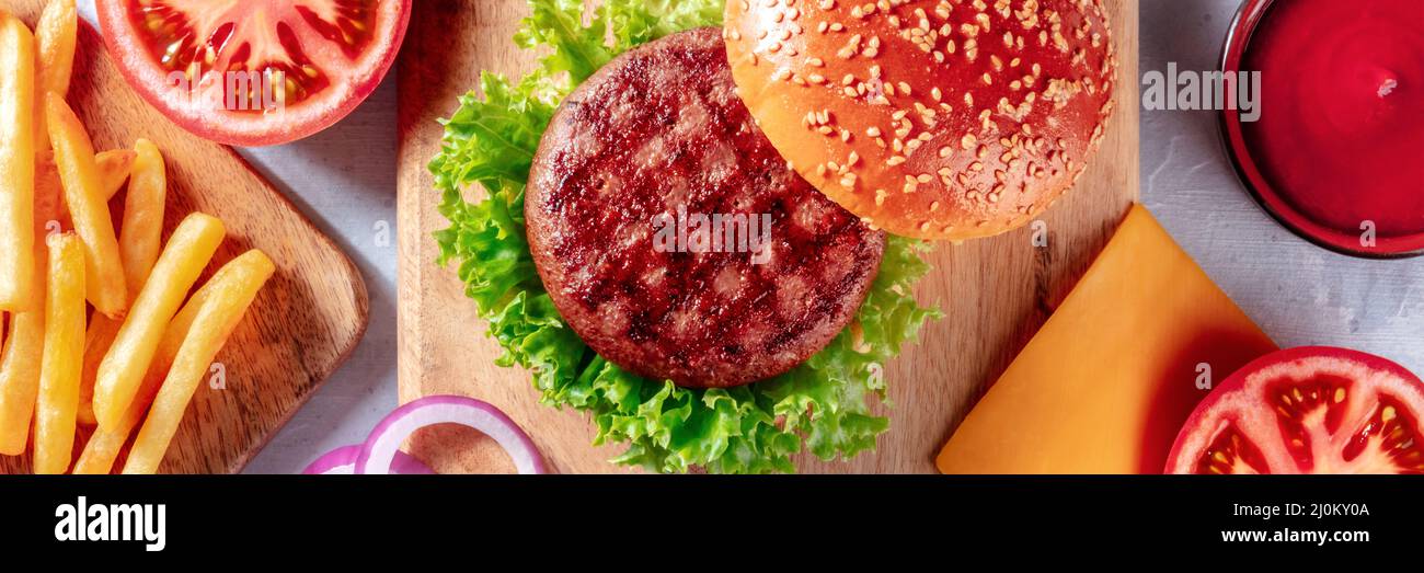 Burger ingredients panorama, shot from above. Hamburger beef patty etc ...