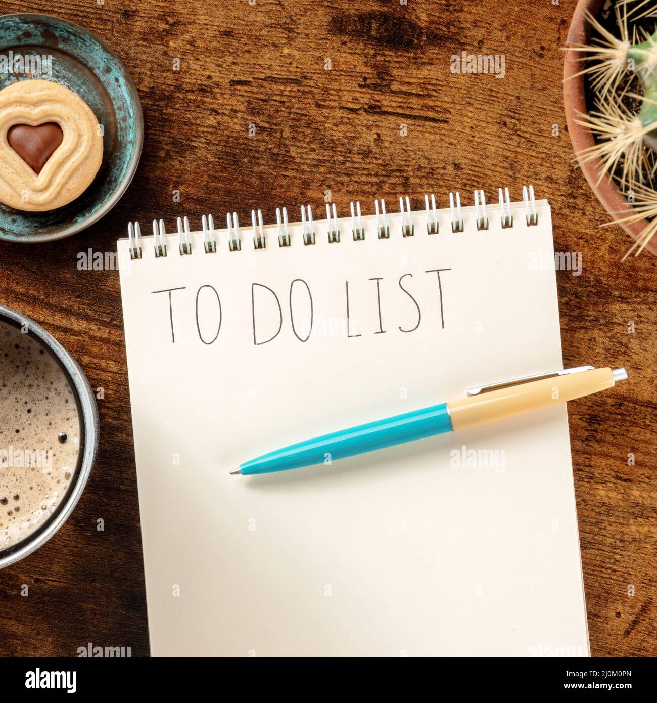 To do list, square overhead shot of a notebook on a wooden desk, with a ...
